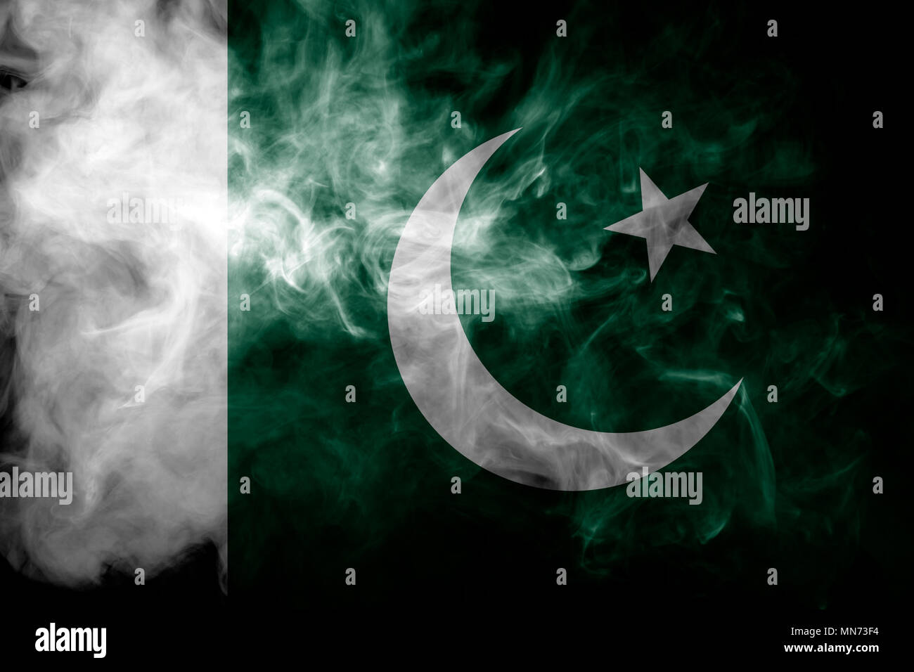 National flag of Pakistan from thick colored smoke on a black isolated ...