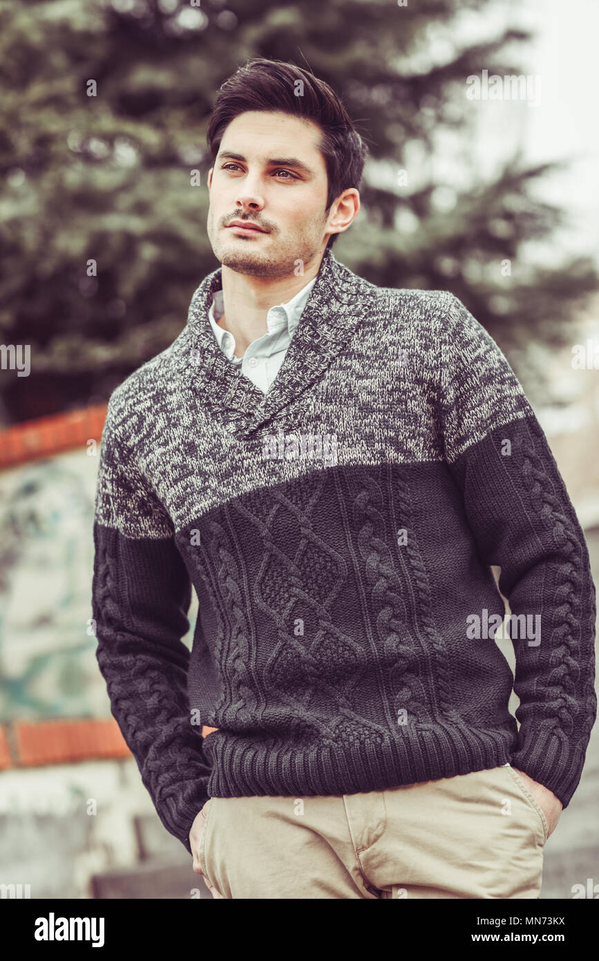 Portrait of a young handsome man, model of fashion, with modern ...