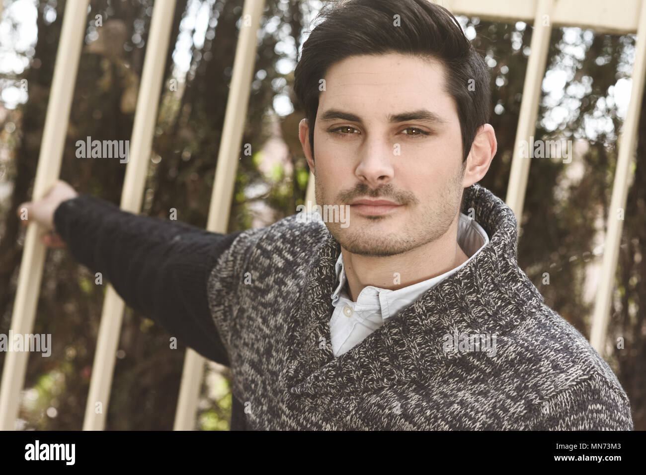 Portrait of a young handsome man, model of fashion, with modern ...