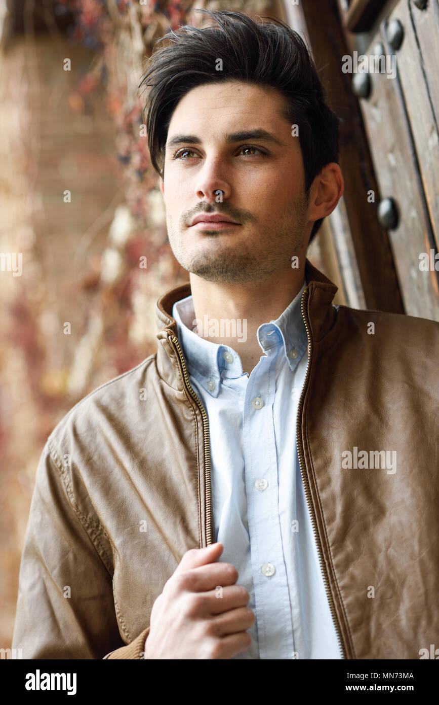 Portrait of a young handsome man, model of fashion, with modern ...