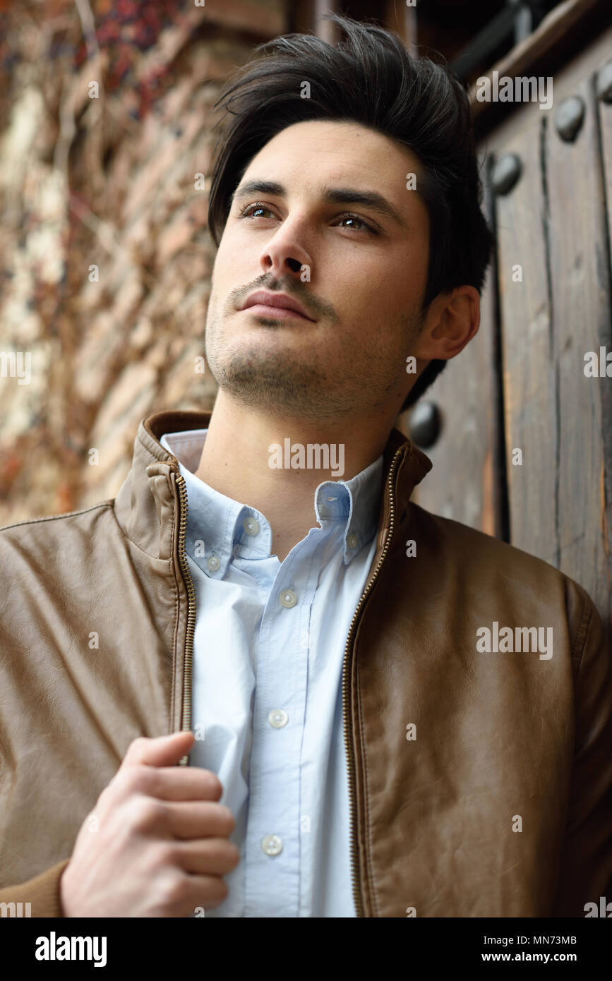 Portrait of a young handsome man, model of fashion, with modern ...