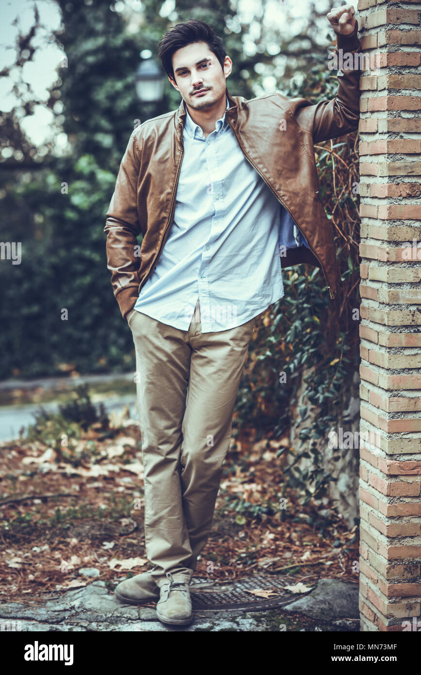 Portrait of a young handsome man, model of fashion, with modern ...