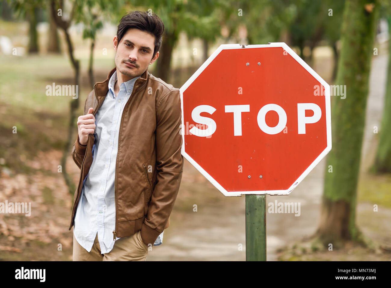 Portrait of a young handsome man, model of fashion, with modern ...