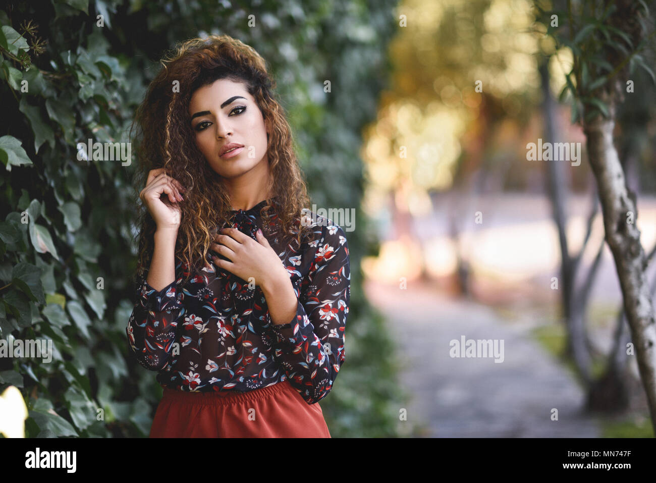 Beautiful young arabic woman with black curly hairstyle. Arab girl ...