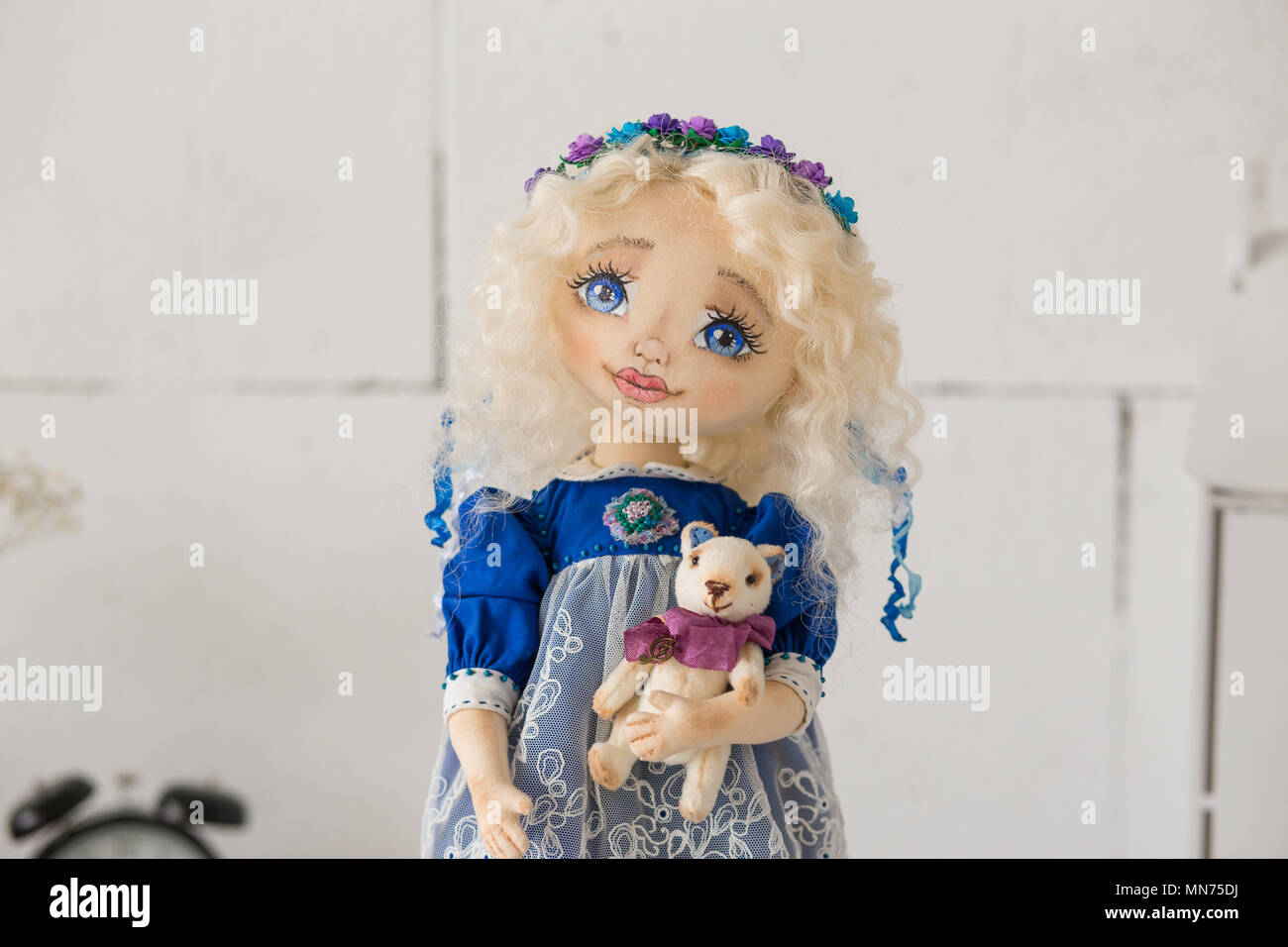 Portrait of textile handmade vintage doll with blue eyes, long blond ...