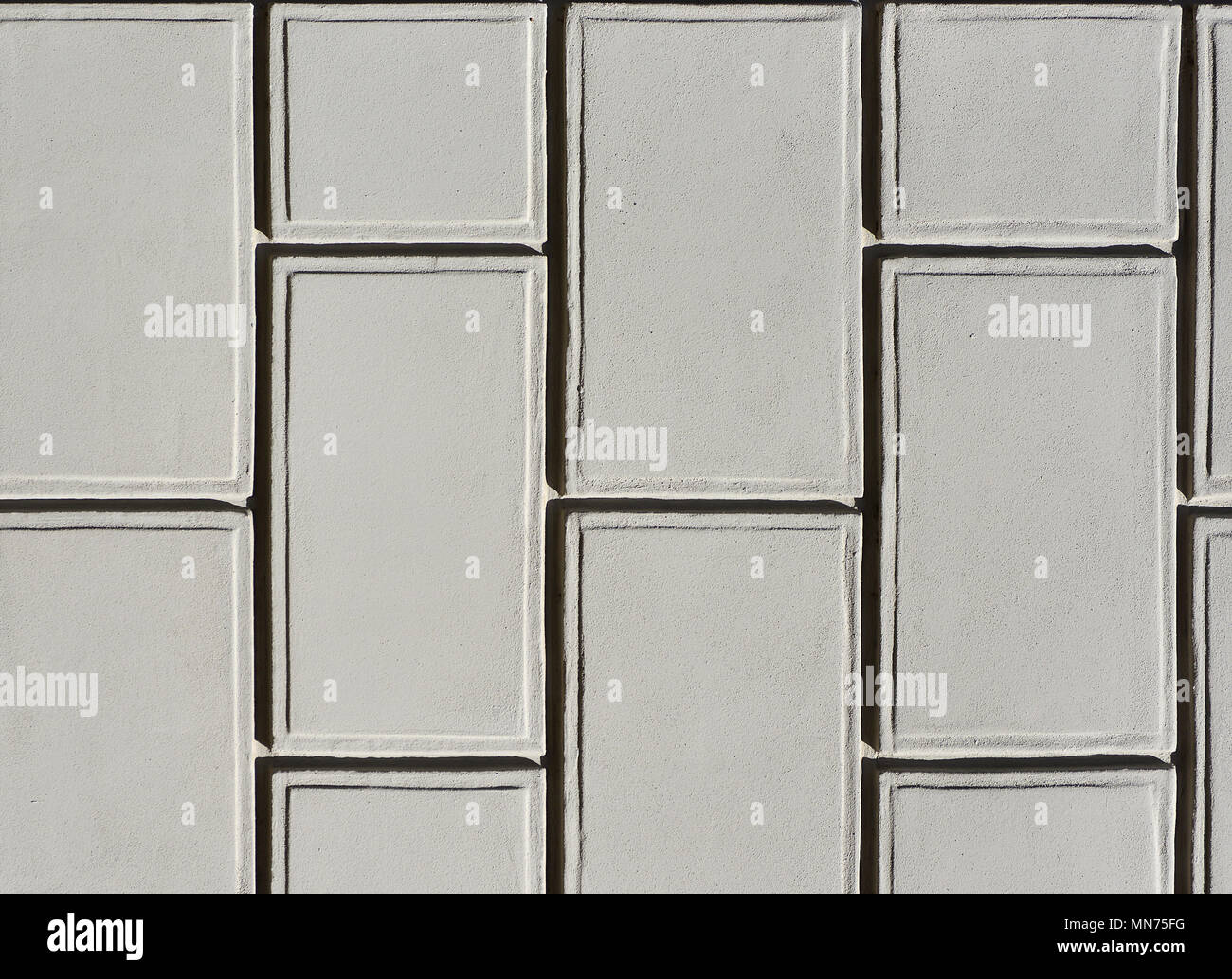 Wall with white plaster, rectangles and verticall lines as background ...