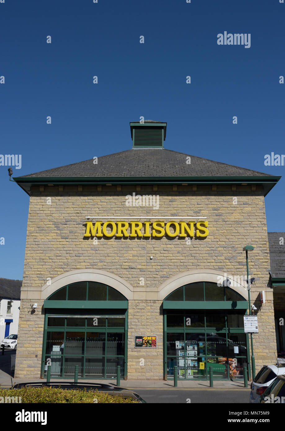 Morrisons supermarket with stone wall two stone window arches and slate ...