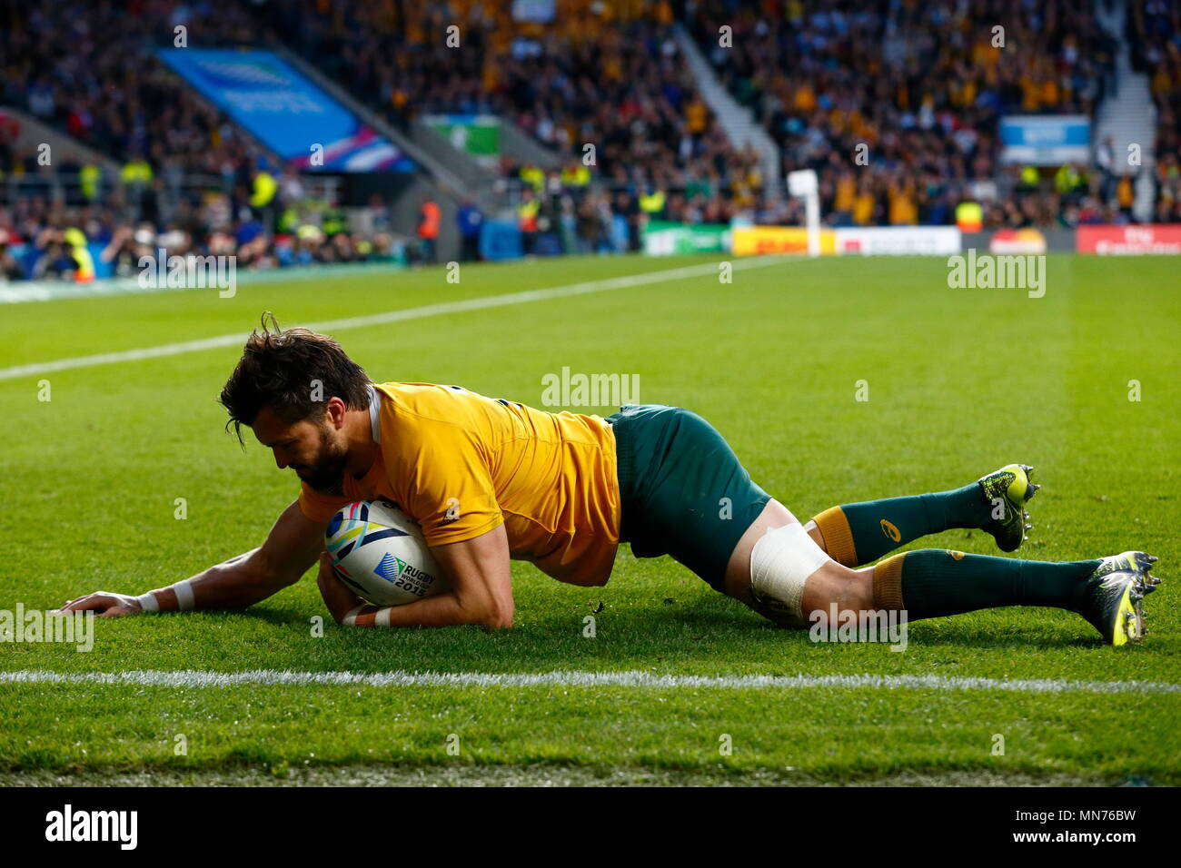 Adam Ashley-Cooper runs in a third try for Australia during the IRB RWC ...