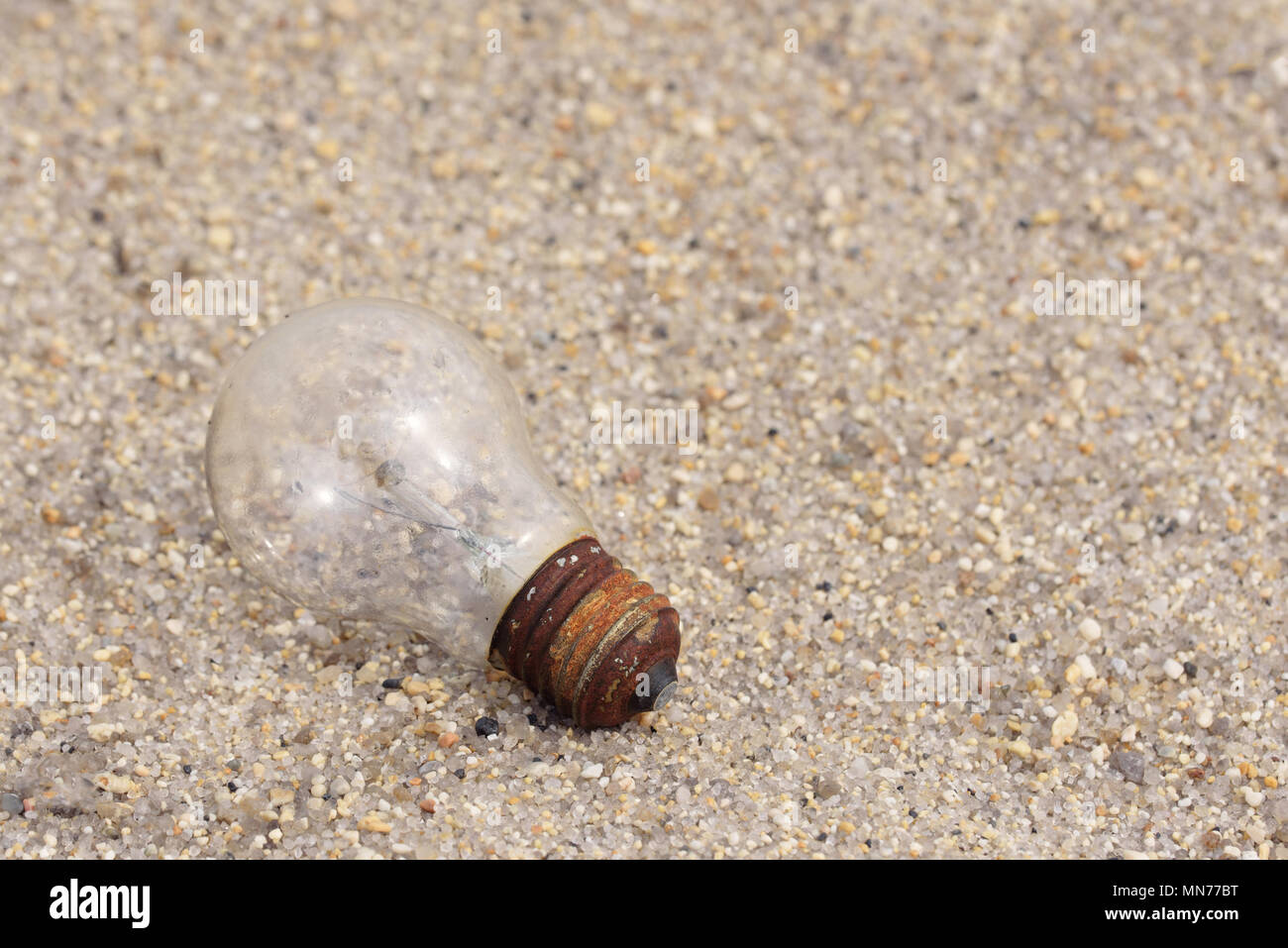 electric light bulb on sand Stock Photo - Alamy