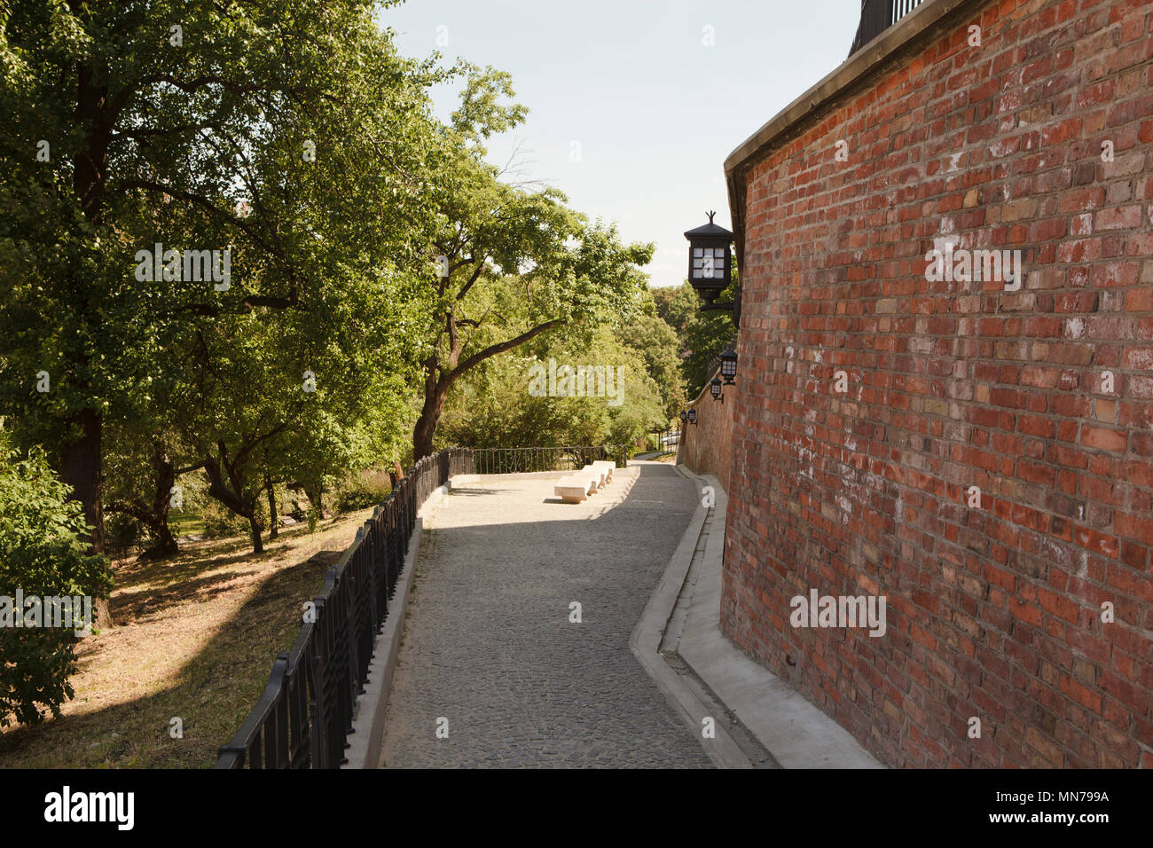 old park avenue along red wall Stock Photo - Alamy