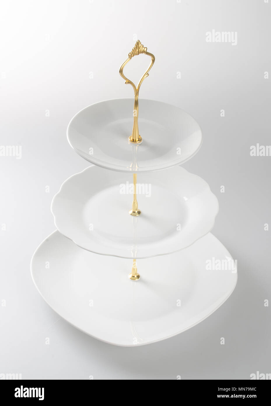 tray or three tier serving tray on a background Stock Photo - Alamy