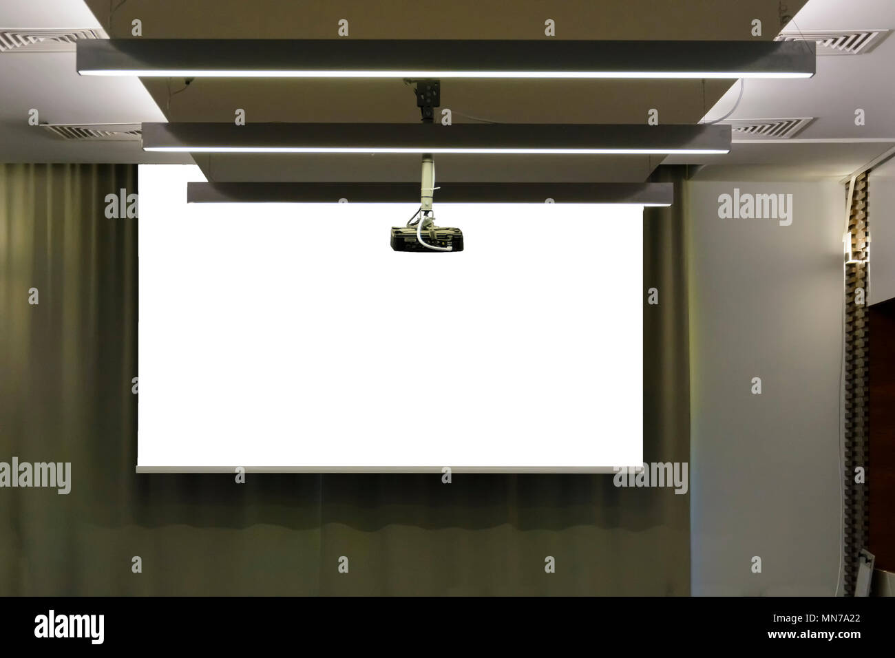 Projector in a room with projector screen on back ground Stock Photo ...