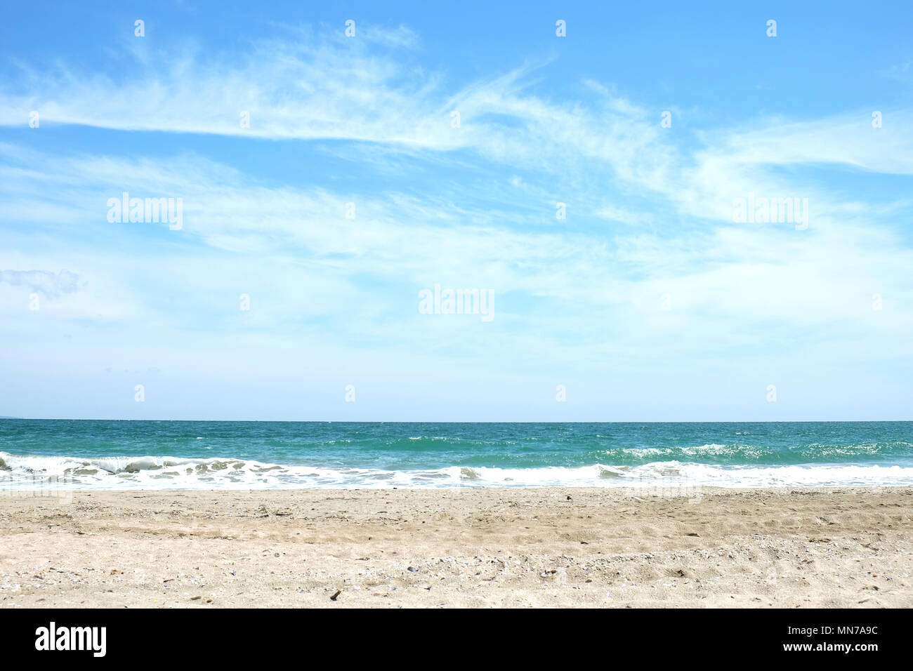 Beach and sea in bright sunlight Stock Photo - Alamy