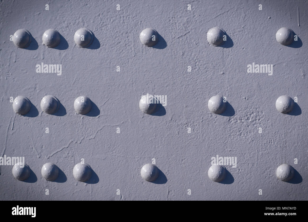 metal background with rivets painted gray. industrial, texture ...