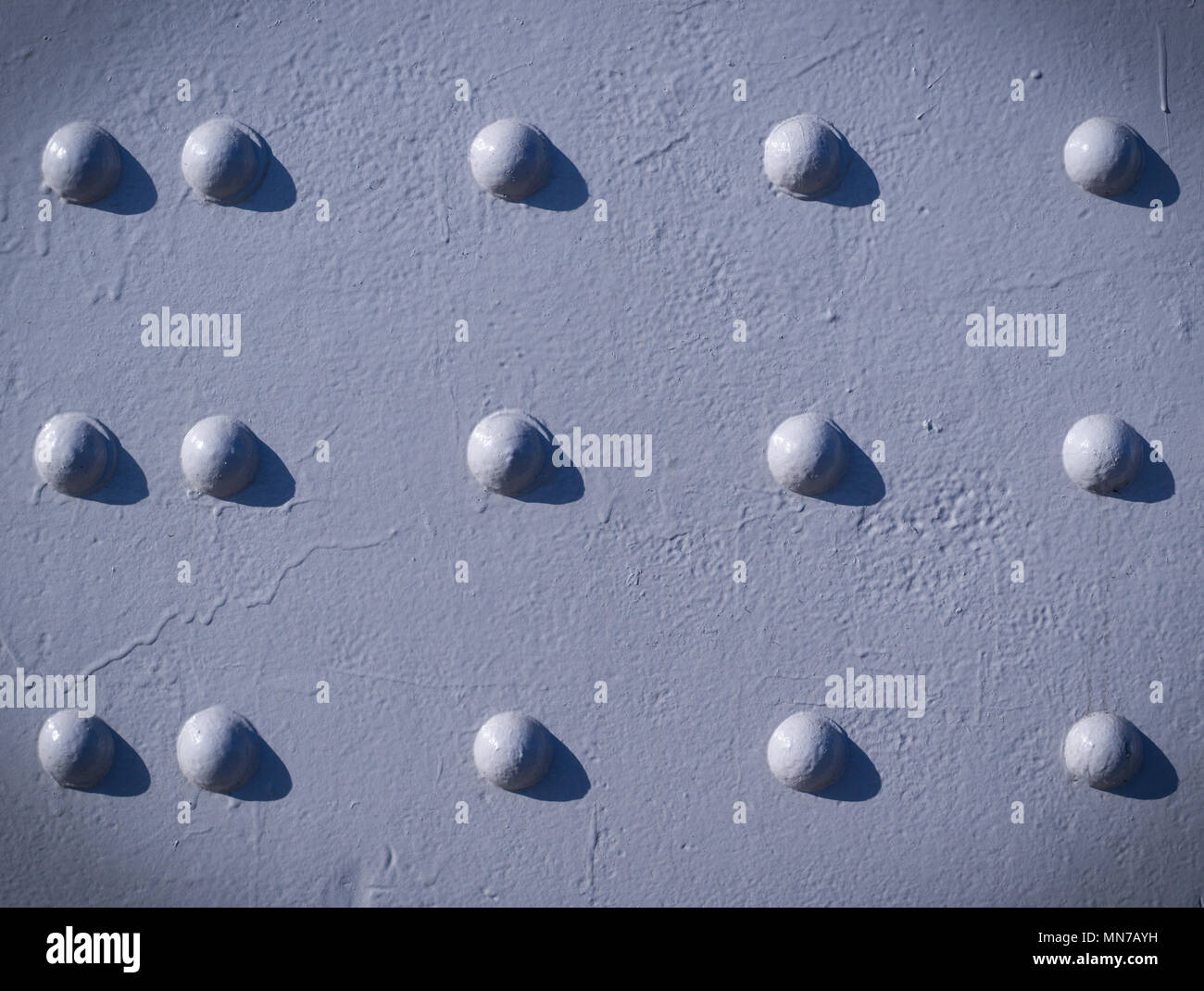 metal background with rivets painted gray. industrial, texture ...