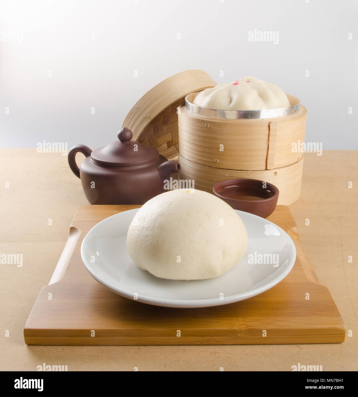 pao or dim sum with chinese tea on background Stock Photo - Alamy