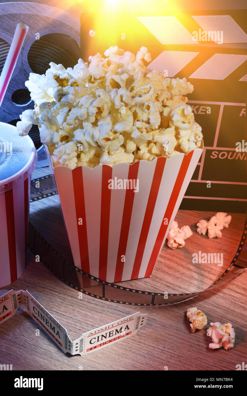 Equipment and elements of cinema on wooden table and background cinema ...