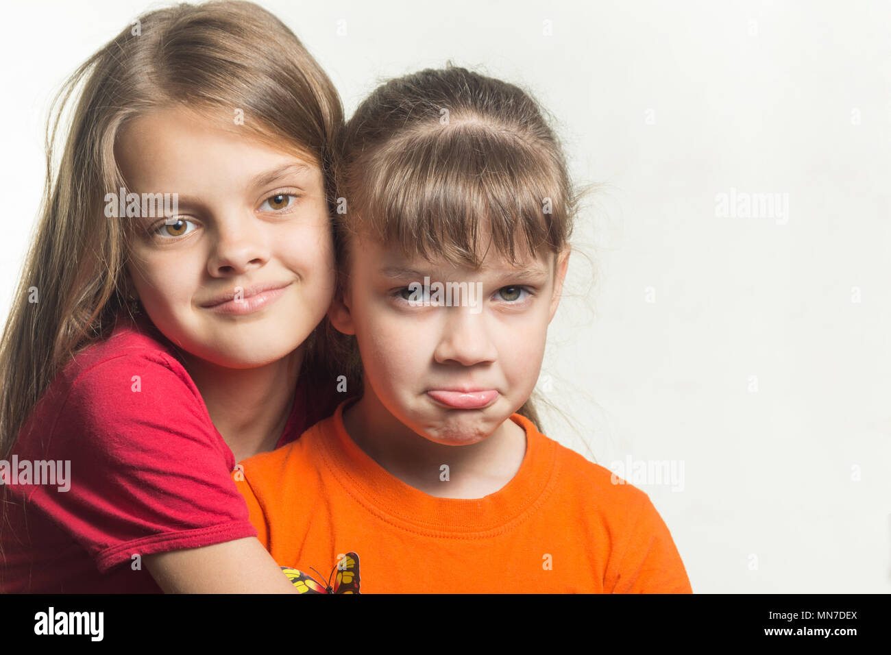 Portrait of two sisters with different characters Stock Photo - Alamy