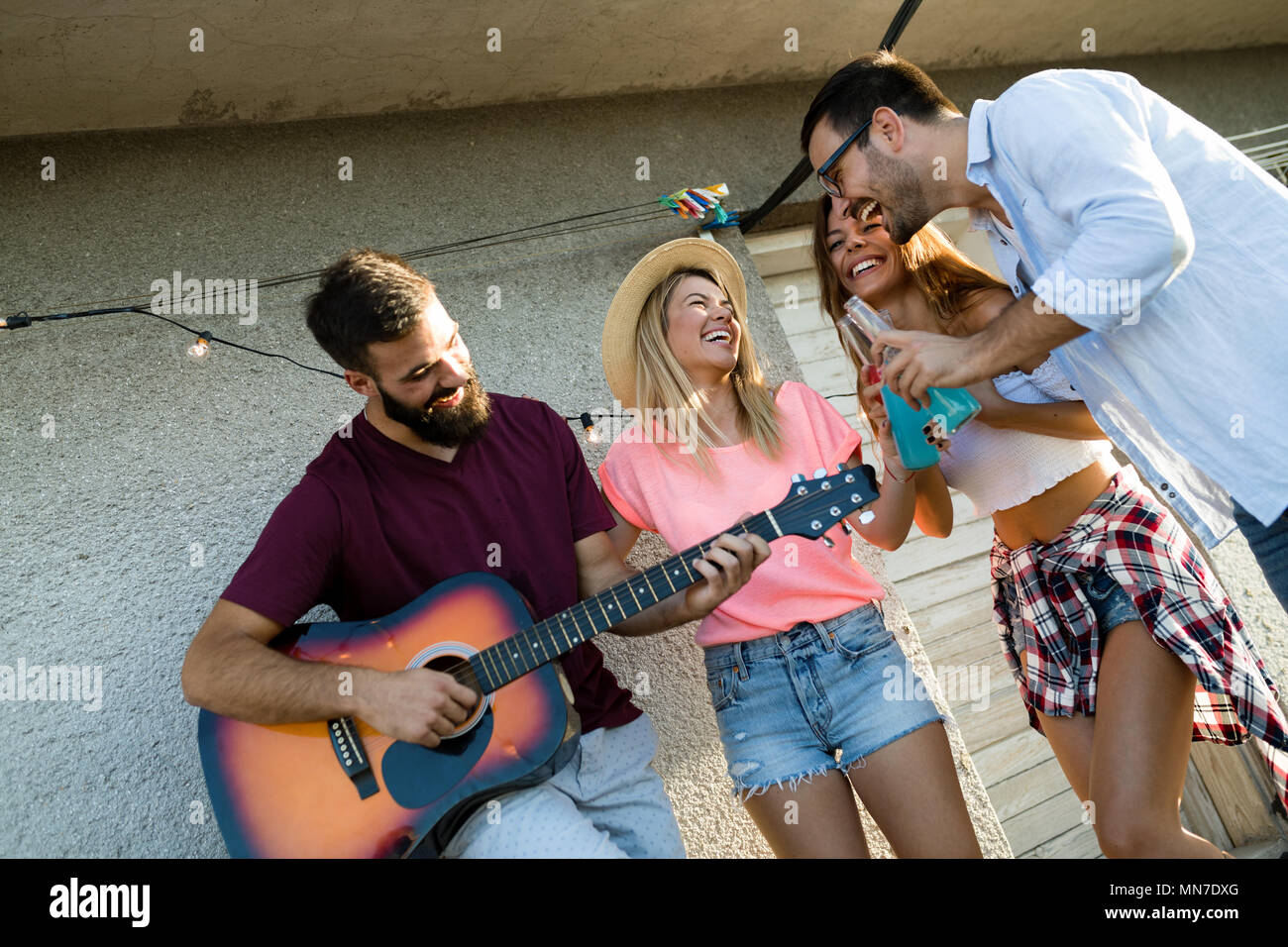 Happy friends laughing and smiling outdoors Stock Photo - Alamy