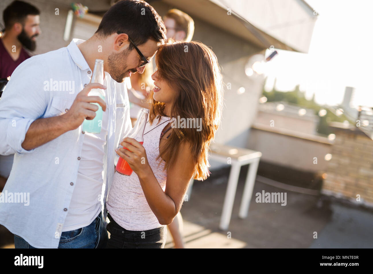Happy couple having fun time at party Stock Photo - Alamy