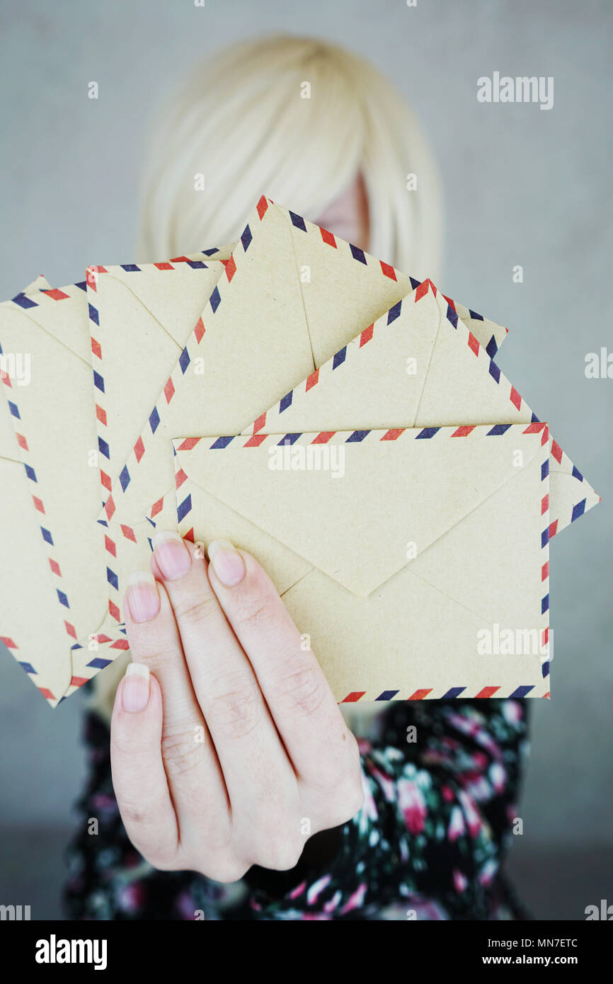 Woman invitation smile envelope hi-res stock photography and images - Alamy