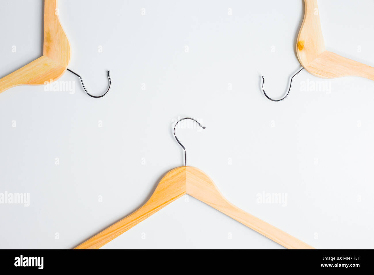 Wood Hangers flat lay image on white background Stock Photo - Alamy