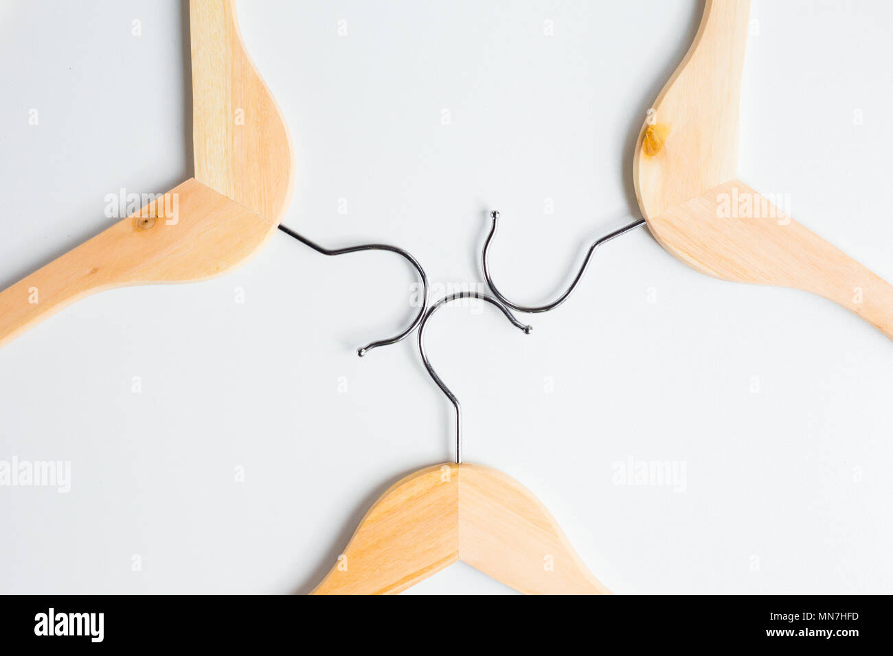 Wood Hangers flat lay image on white background Stock Photo - Alamy