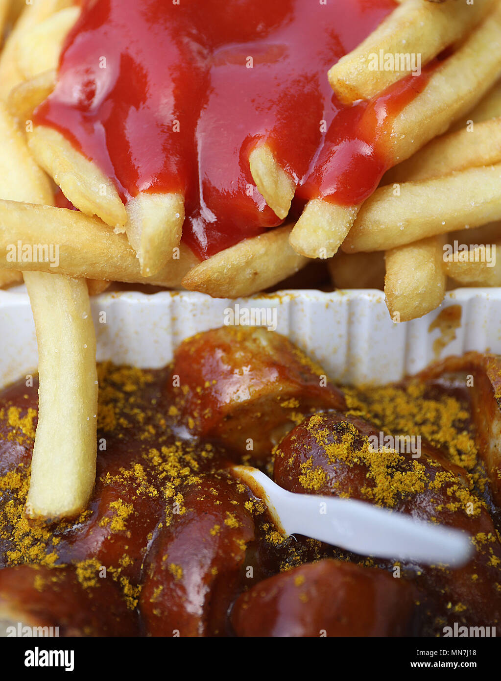 ILLUSTRATION - 14 May 2018, Germany, Cologne: A currywurst (lit. curry ...