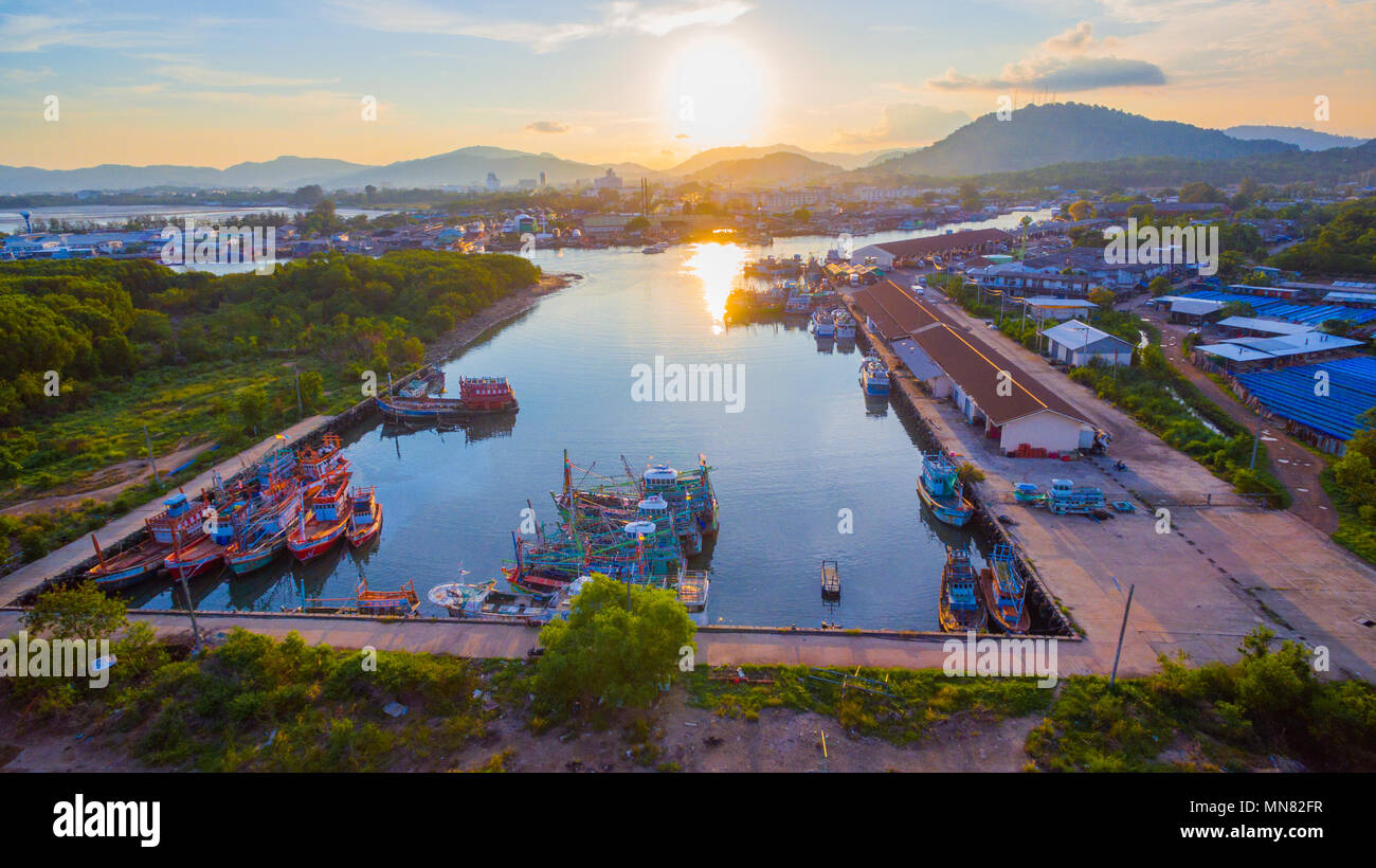aerial scenery sunset at Siray fishing port. Phuket Fishing Port is the ...