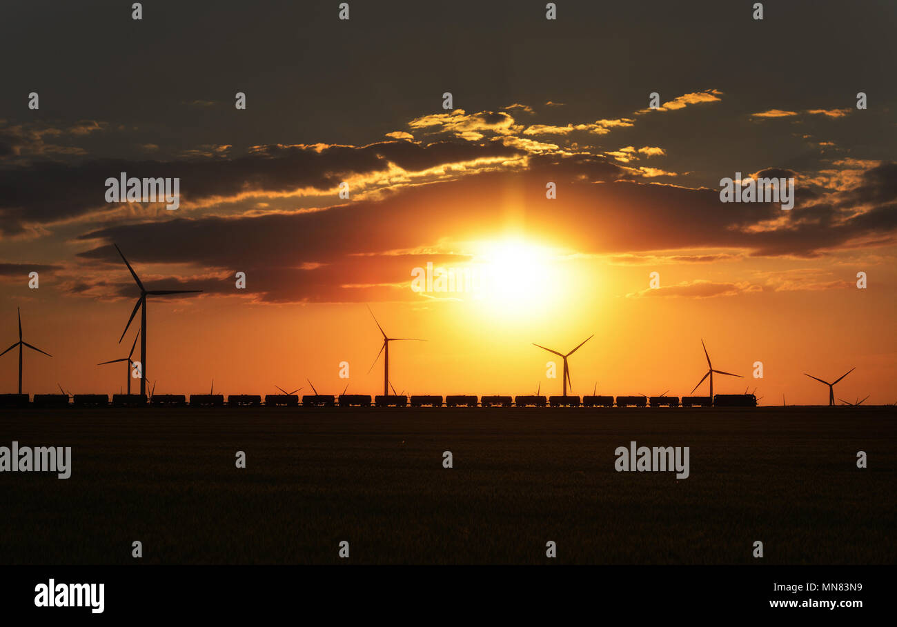 Sunset with wind turbines in Dobrogea , Romania Stock Photo - Alamy