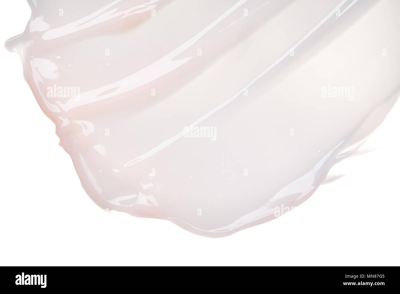 Gently pink creamy texture isolated on white background. Smear of face ...