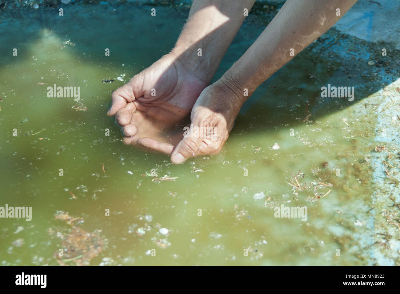 Hands scooping water hi-res stock photography and images - Alamy
