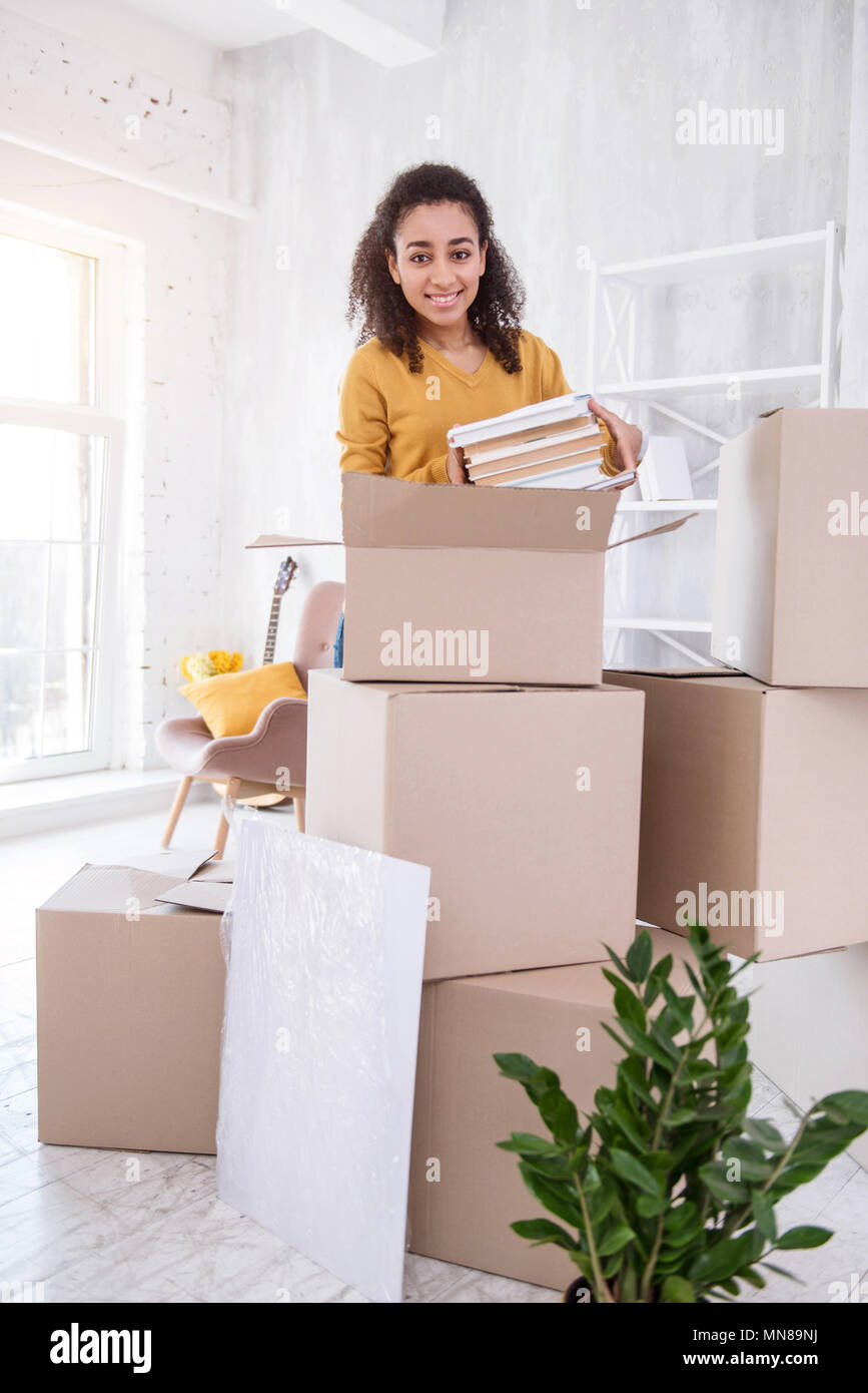 Girl Packing Books High Resolution Stock Photography and Images - Alamy