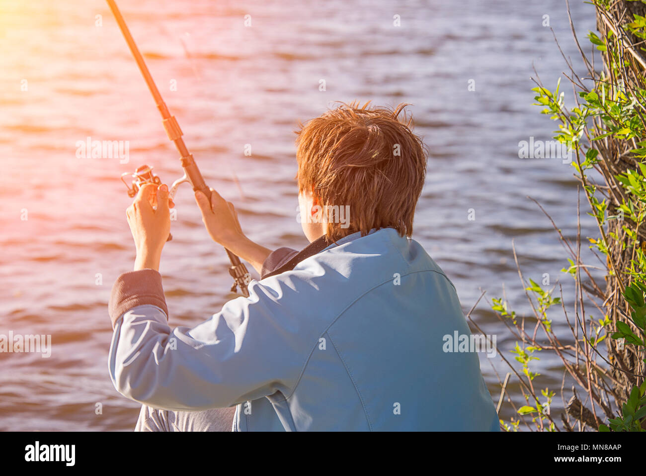 Girl holding fishing pole hi-res stock photography and images - Alamy