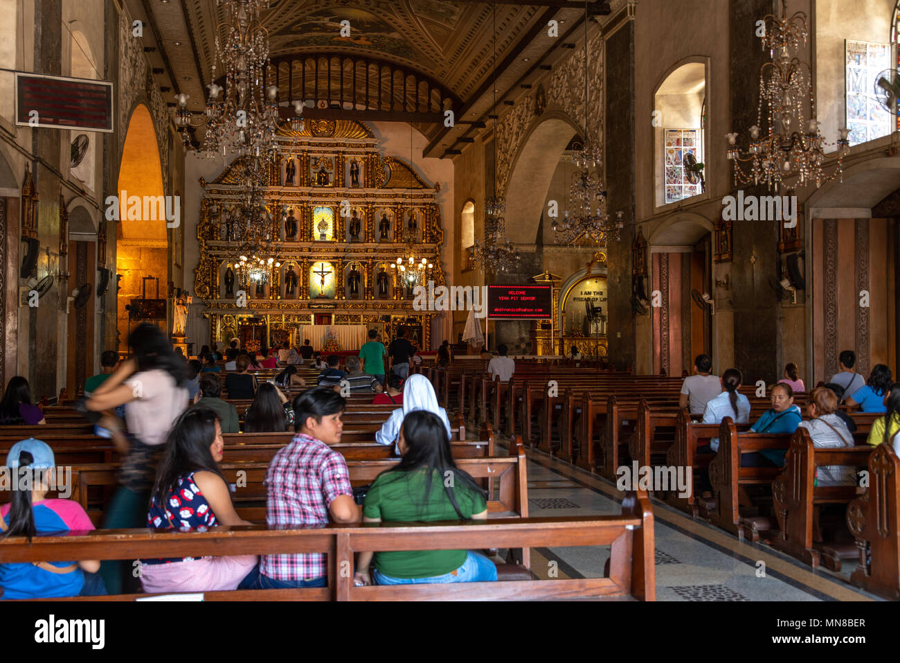 Cebu city, Philippines Apr 25,2018 - People praying in the Sto Nino ...