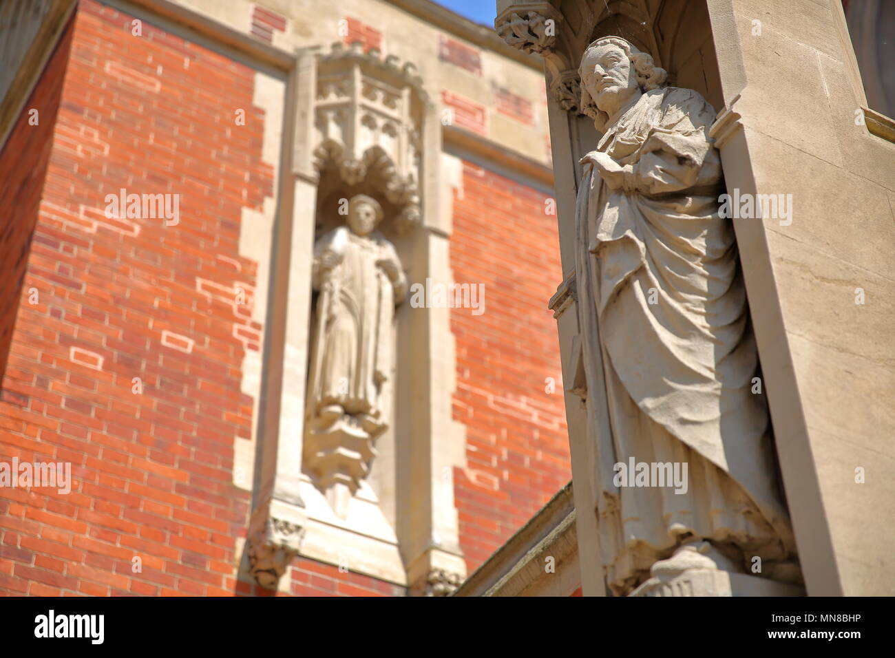 CAMBRIDGE, UK - MAY 6, 2018: Close-up on statues at Old Divinity School ...