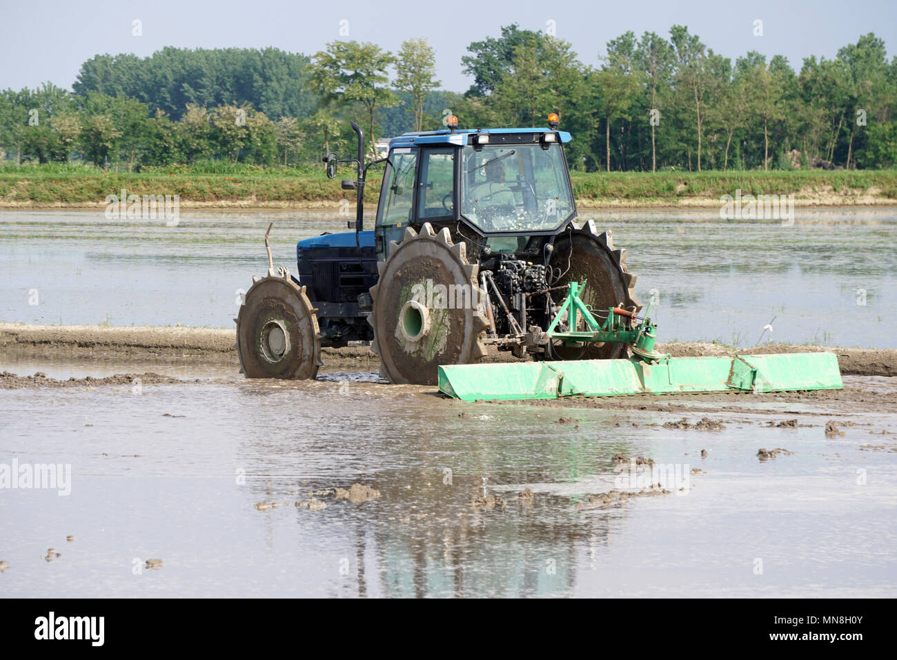 rice farming tractor in northern Italy Stock Photo - Alamy