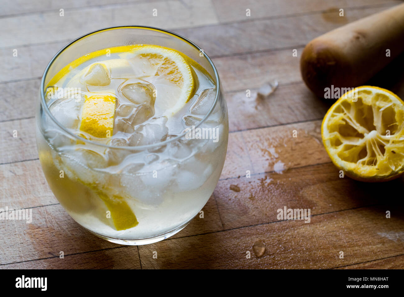 Tom Collins Cocktail with lemon and ice. Beverage Concept Stock Photo ...
