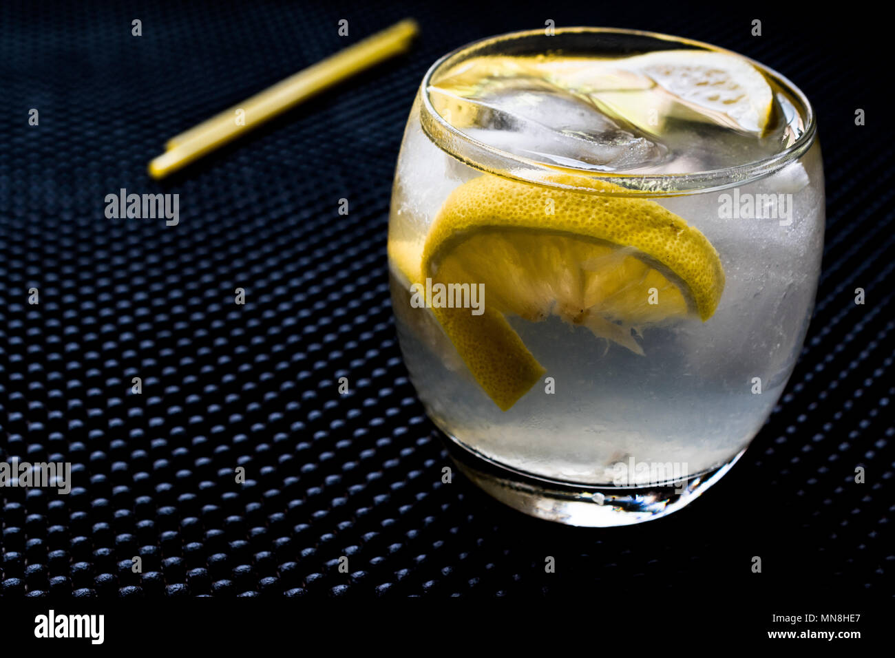 Tom Collins Cocktail with lemon and ice. Beverage Concept Stock Photo ...