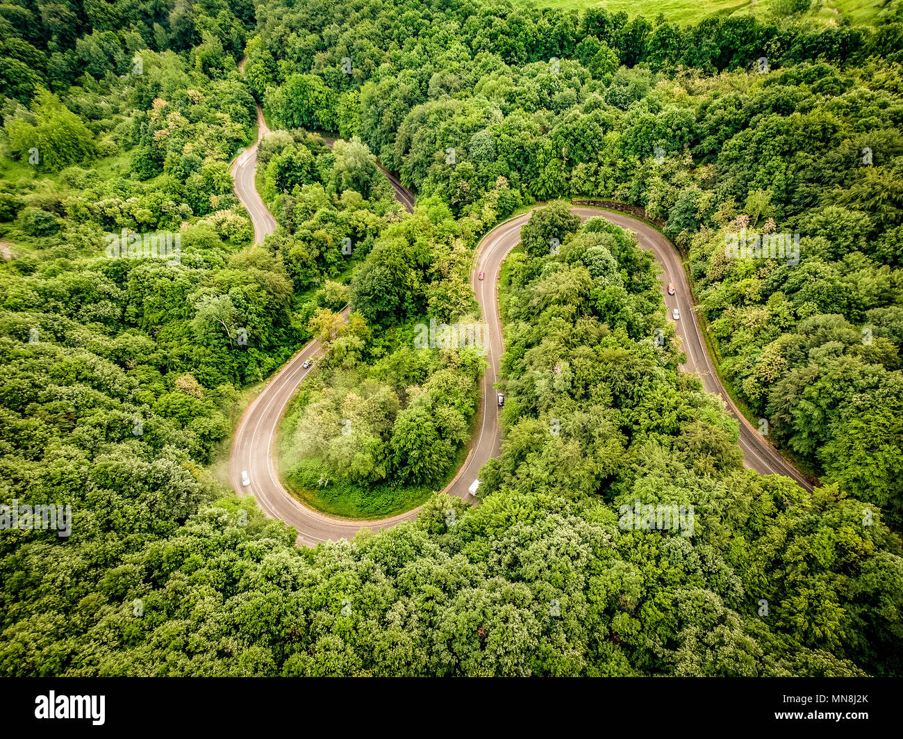 Aerial view of an extreme winding road up in the mountains Stock Photo ...