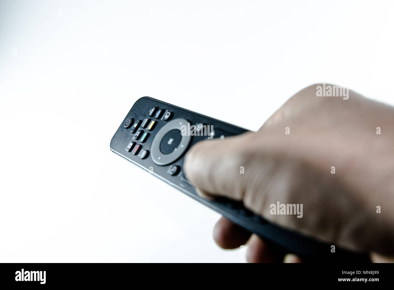 Man holding tv remote hi-res stock photography and images - Alamy