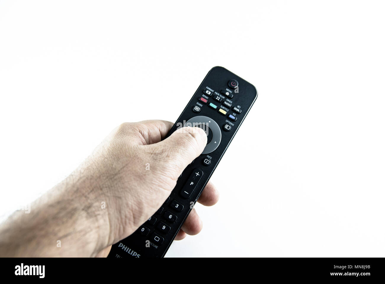 Man holding tv remote hi-res stock photography and images - Alamy