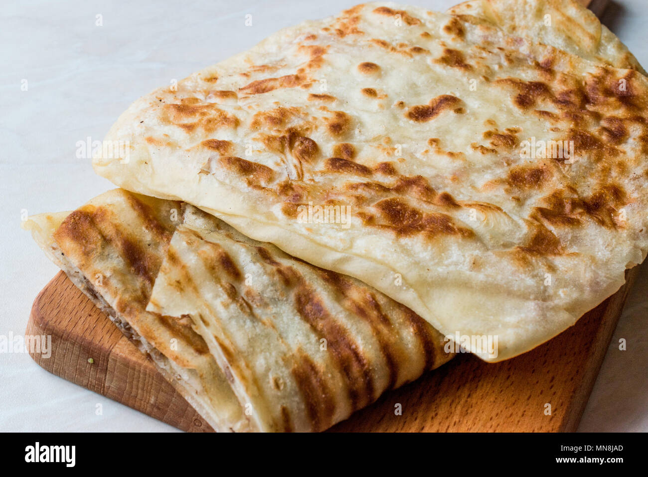 Traditional Qutab or Gozleme made with Dough, Minced Meat or Cheese ...