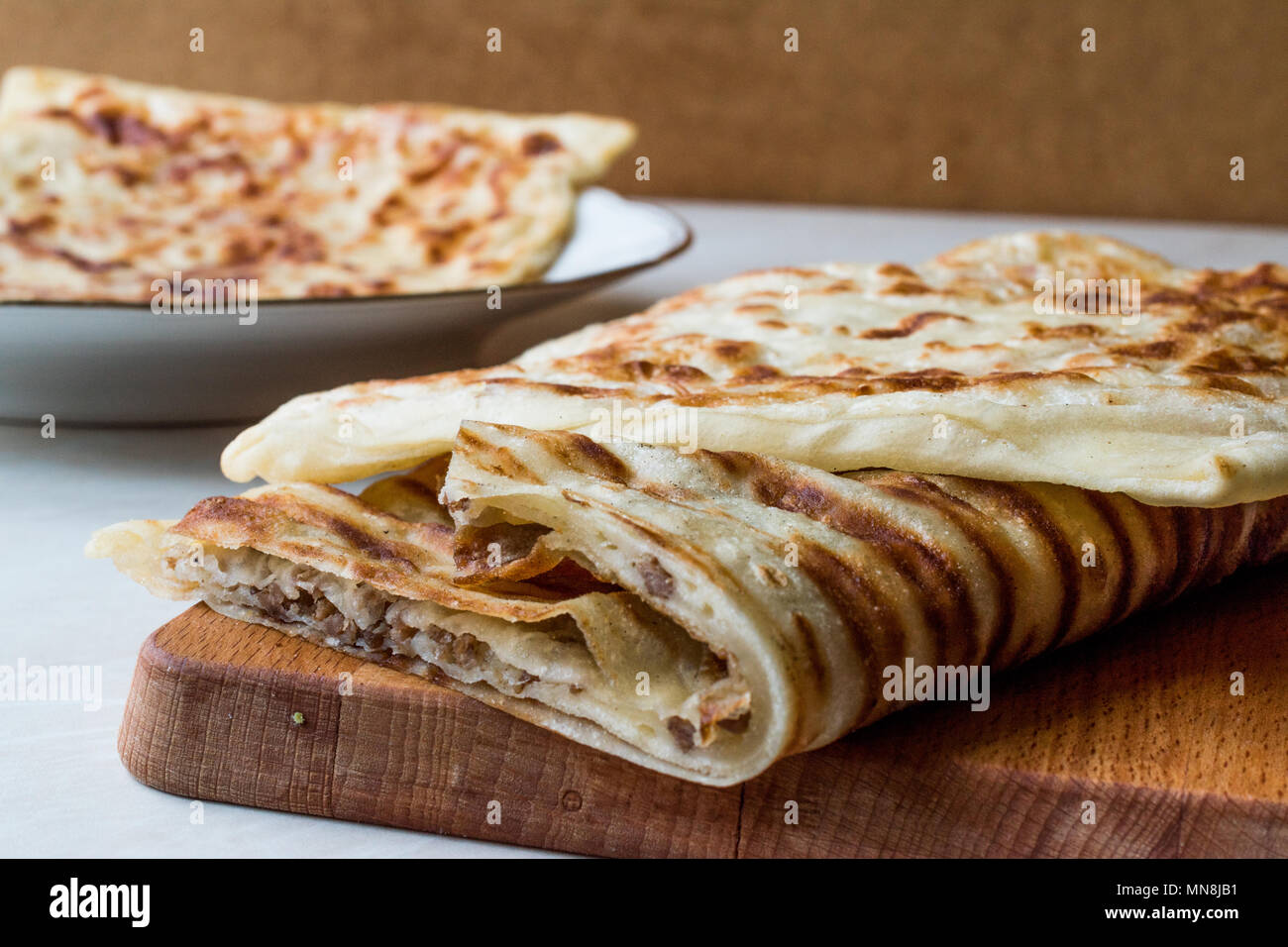 Traditional Qutab or Gozleme made with Dough, Minced Meat or Cheese ...