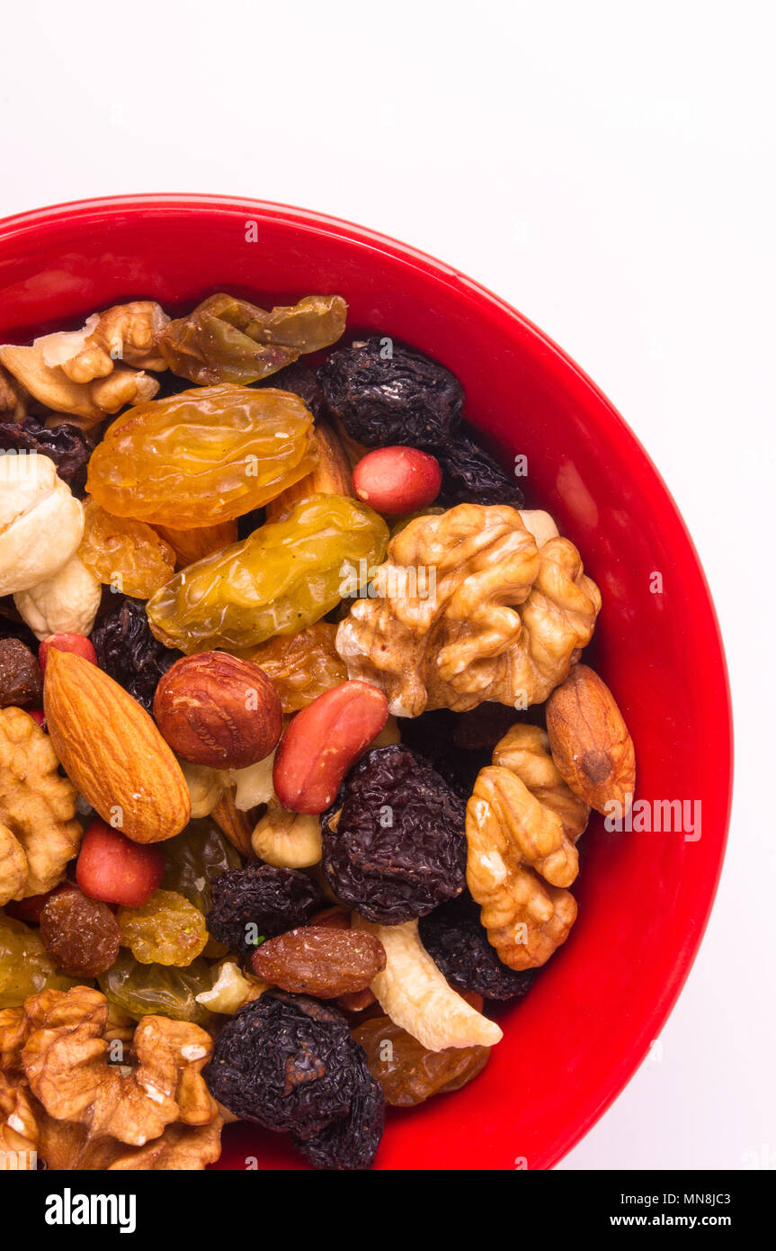 various different mixed nuts and raisins on white background Stock ...