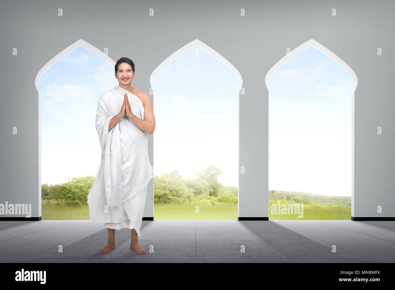 Religious asian muslim man with hand gesture on the mosque Stock Photo ...