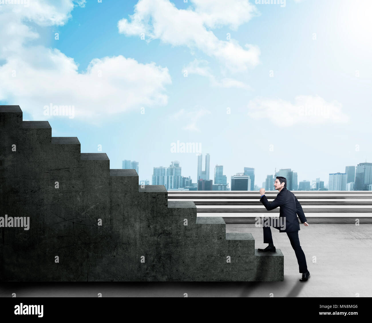 Young man stepping up for success hi-res stock photography and images ...