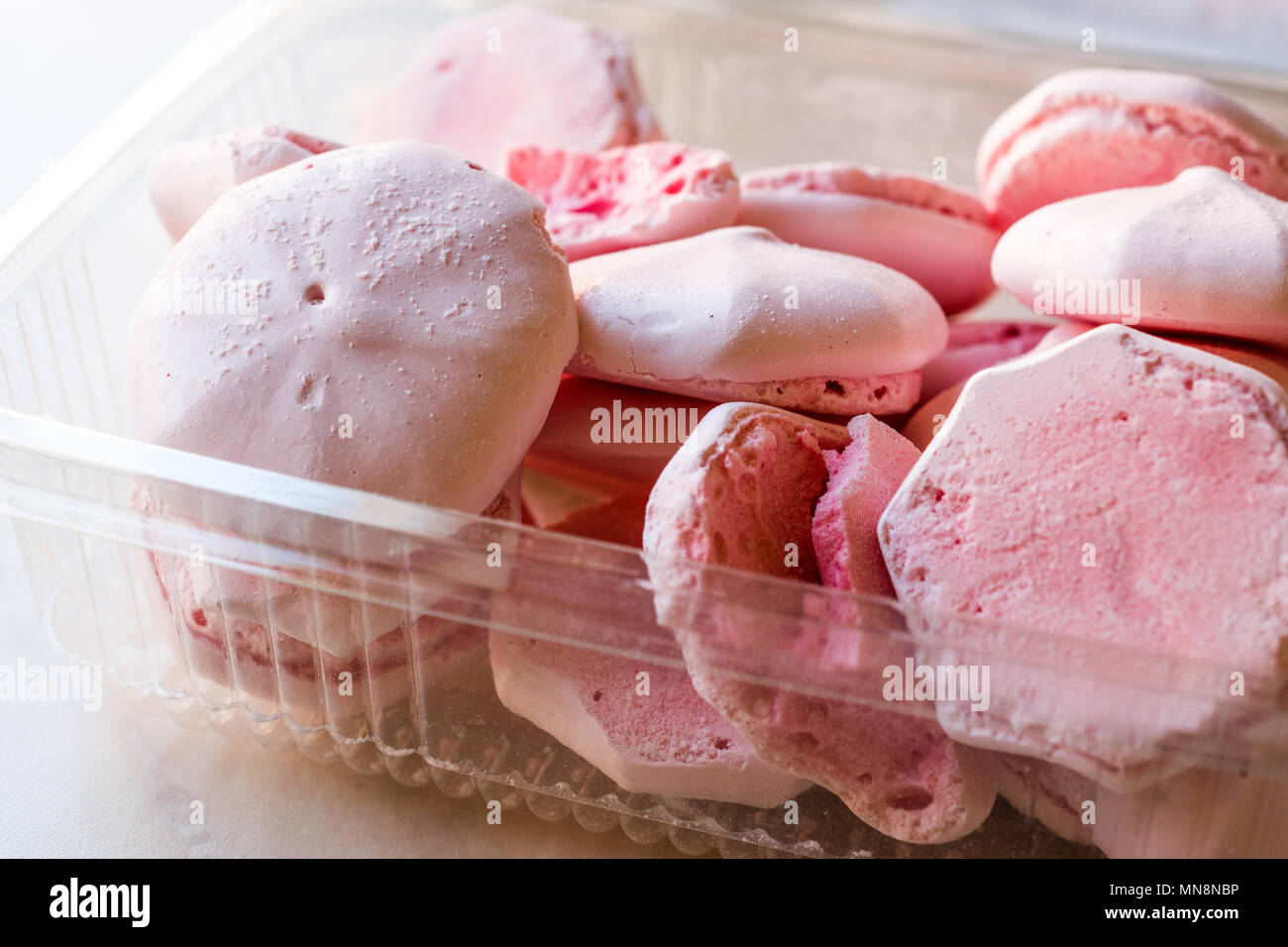 Pink Meringues in Plastic Container / Box or Package. Confectionery ...