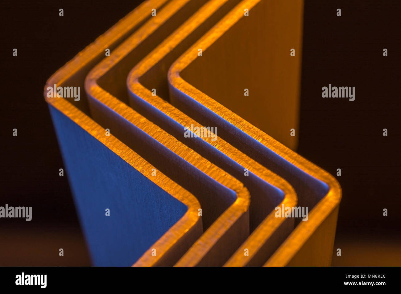 Macro close-up of some aluminium bracket parts. Metaphor for metalwork ...