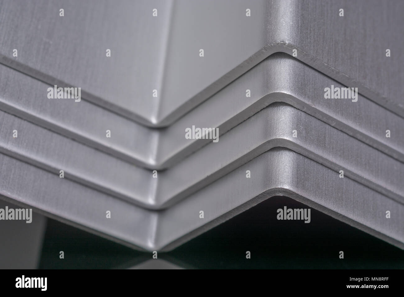 Macro close-up of aluminium bracket parts. Metaphor metalwork, metal ...